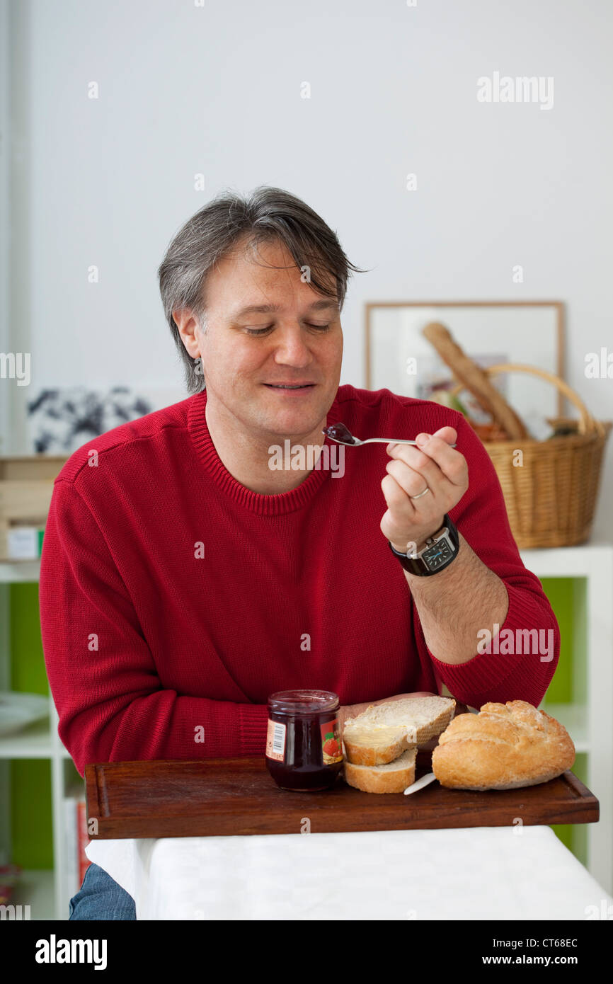 MAN EATING BREAKFAST Stock Photo - Alamy