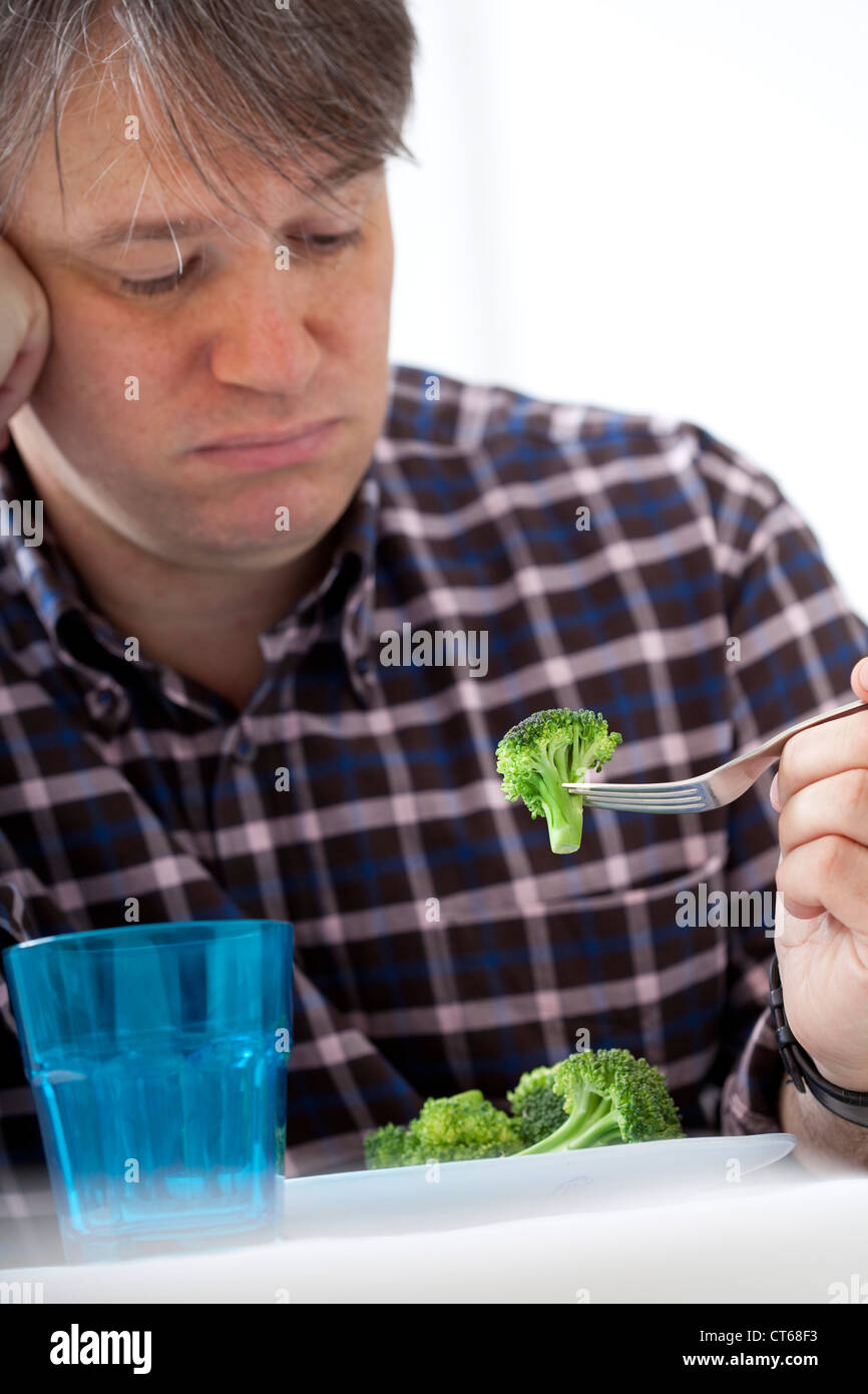 MAN EATING VEGETABLE Stock Photo - Alamy
