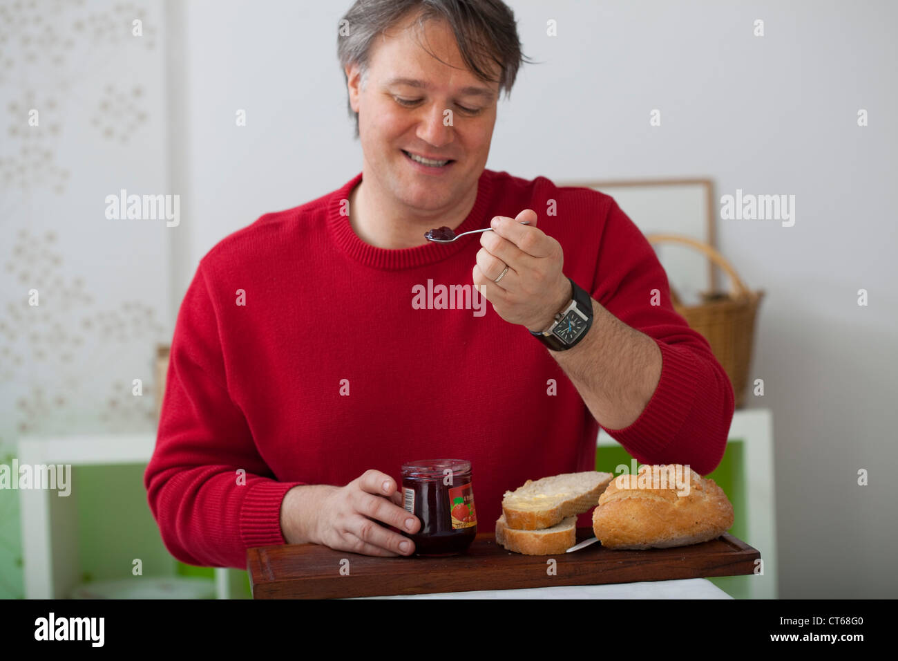 MAN EATING BREAKFAST Stock Photo - Alamy