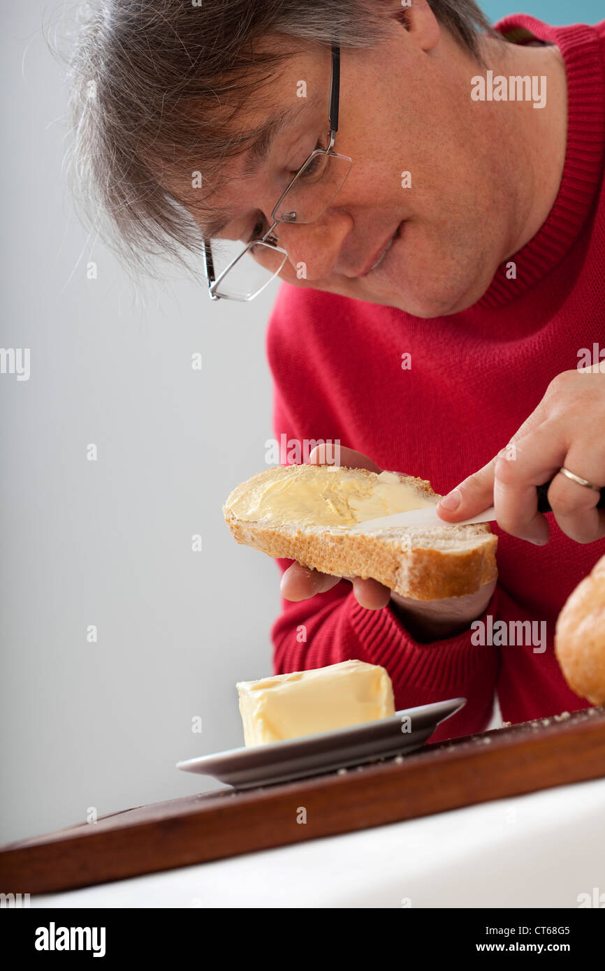 MAN EATING BREAKFAST Stock Photo - Alamy