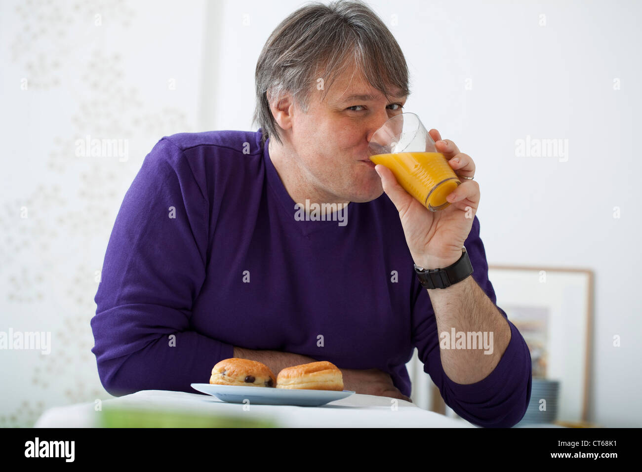 MAN EATING BREAKFAST Stock Photo - Alamy