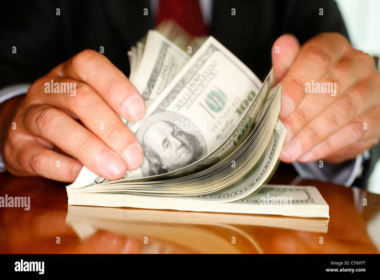 Man with wads of money hi-res stock photography and images - Alamy