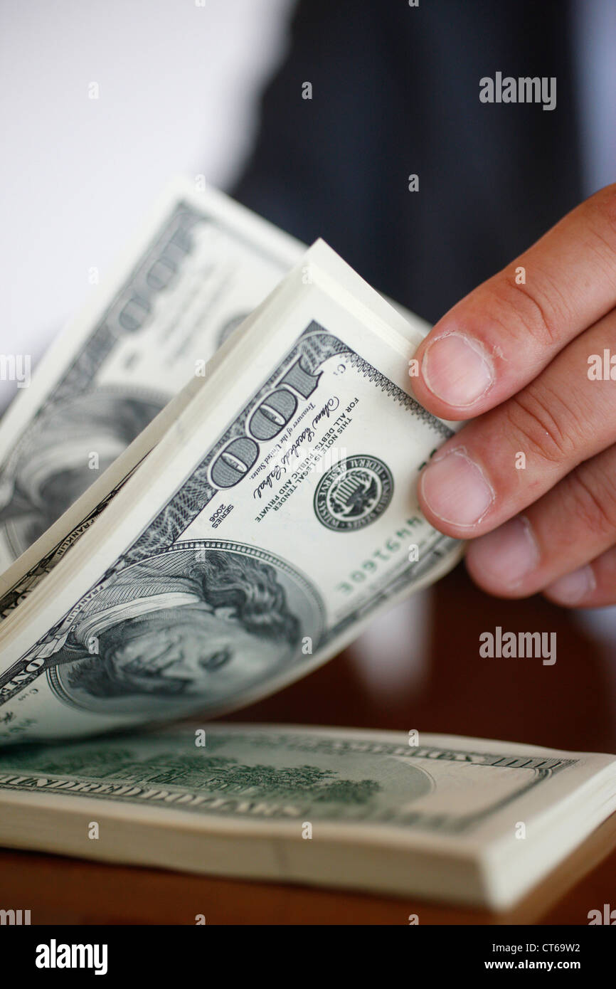 Man with wads of money hi-res stock photography and images - Alamy
