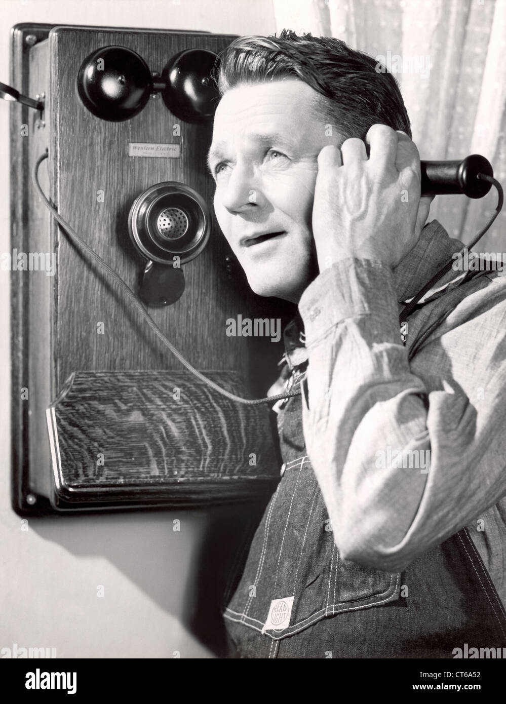 Man using a vintage telephone hi-res stock photography and images - Alamy