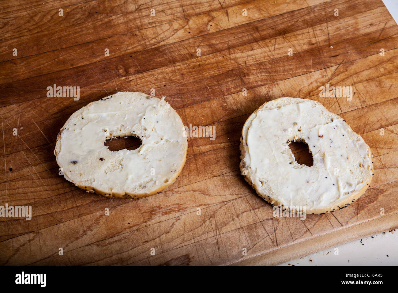 A buttered bagel Stock Photo - Alamy