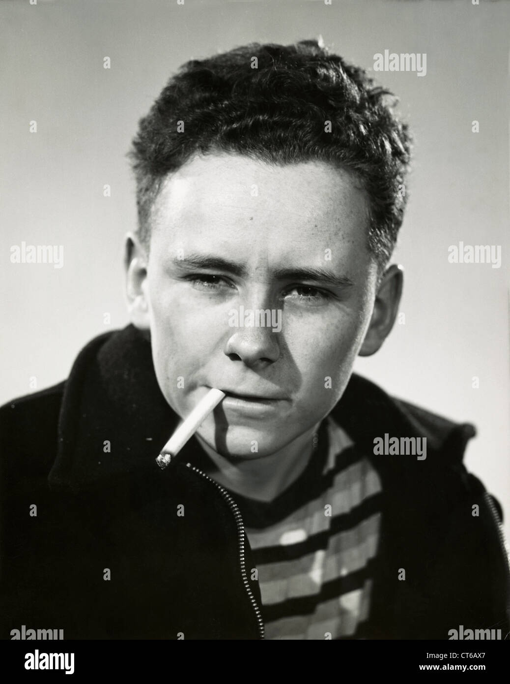Teenage boy smoking Stock Photo - Alamy