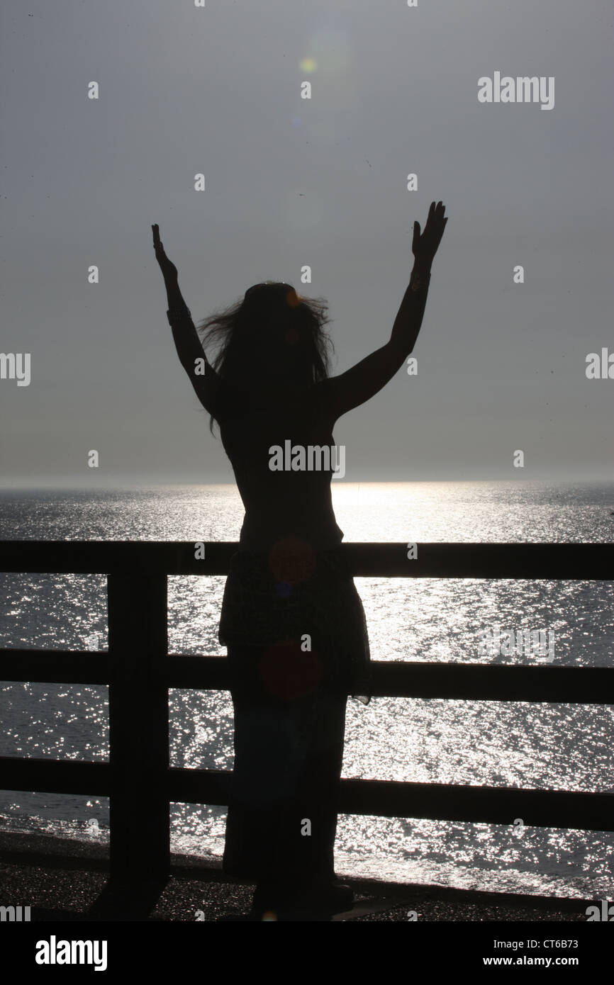 Silhouette women in prayer hi-res stock photography and images - Alamy