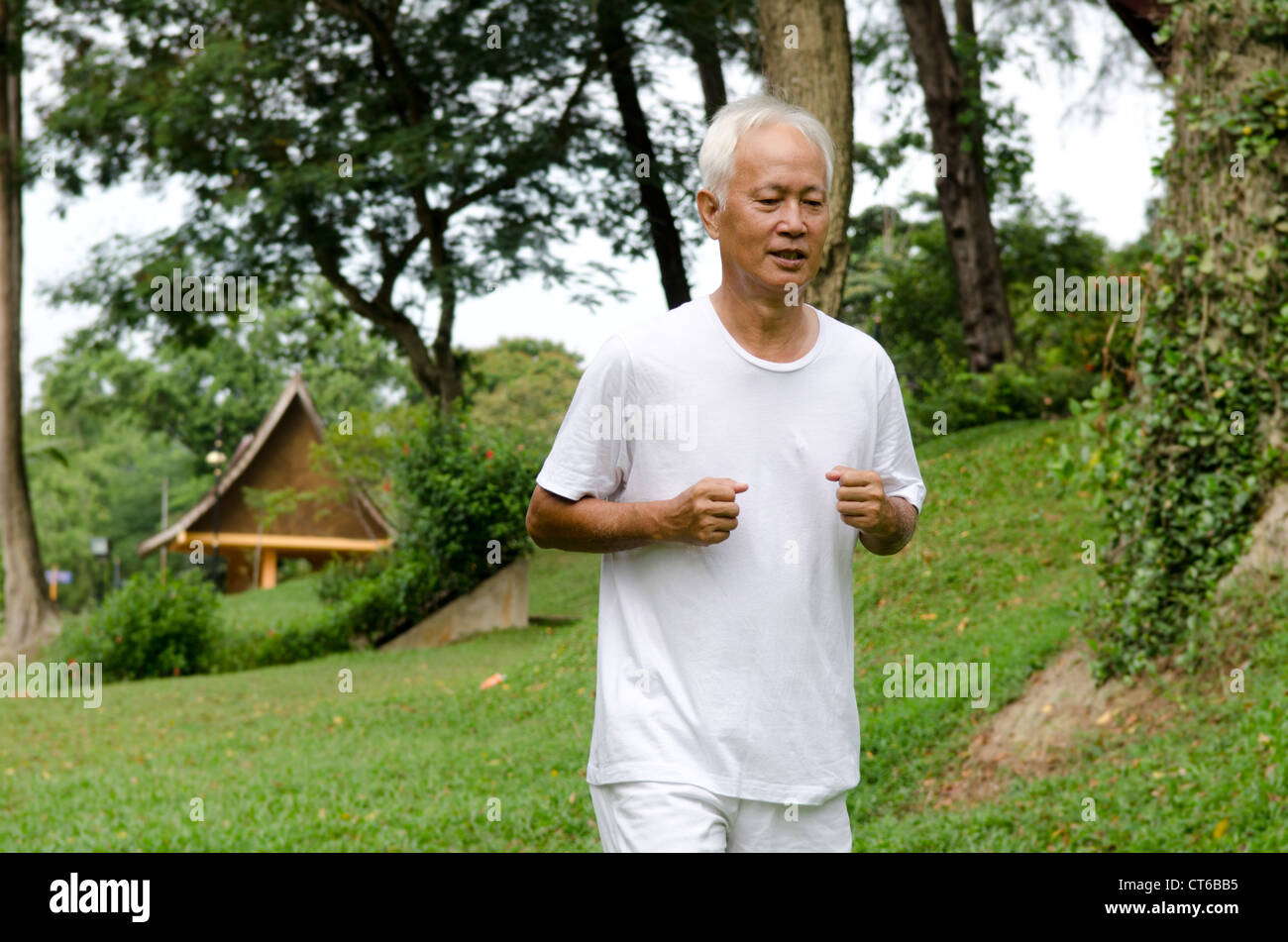 asian senior male jogging Stock Photo - Alamy