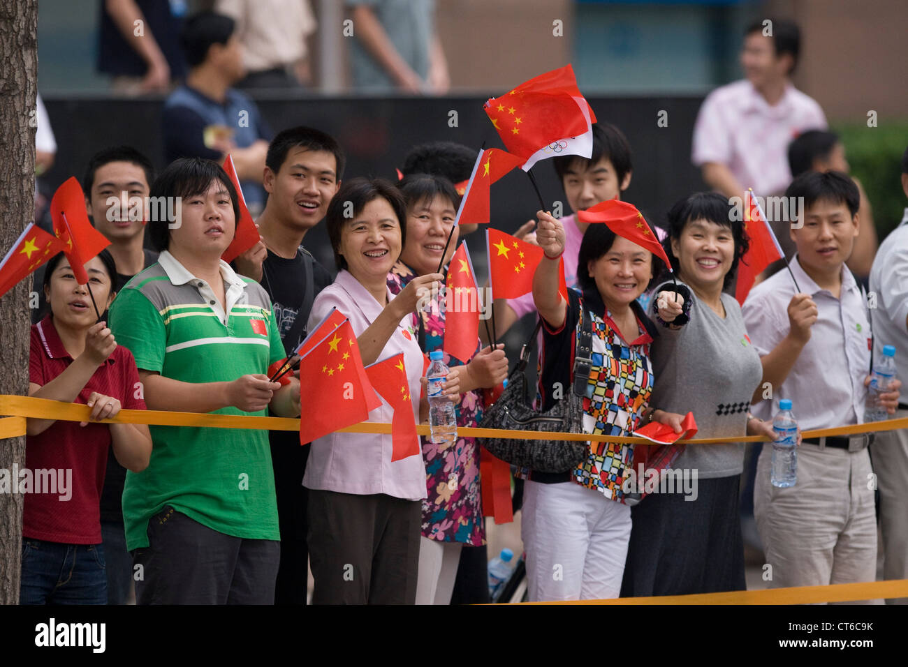 Chinese crowds cheer along the Paralympic Marathon route during the ...