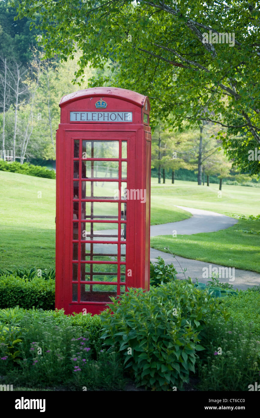Old fashioned telephone booth near path Stock Photo - Alamy
