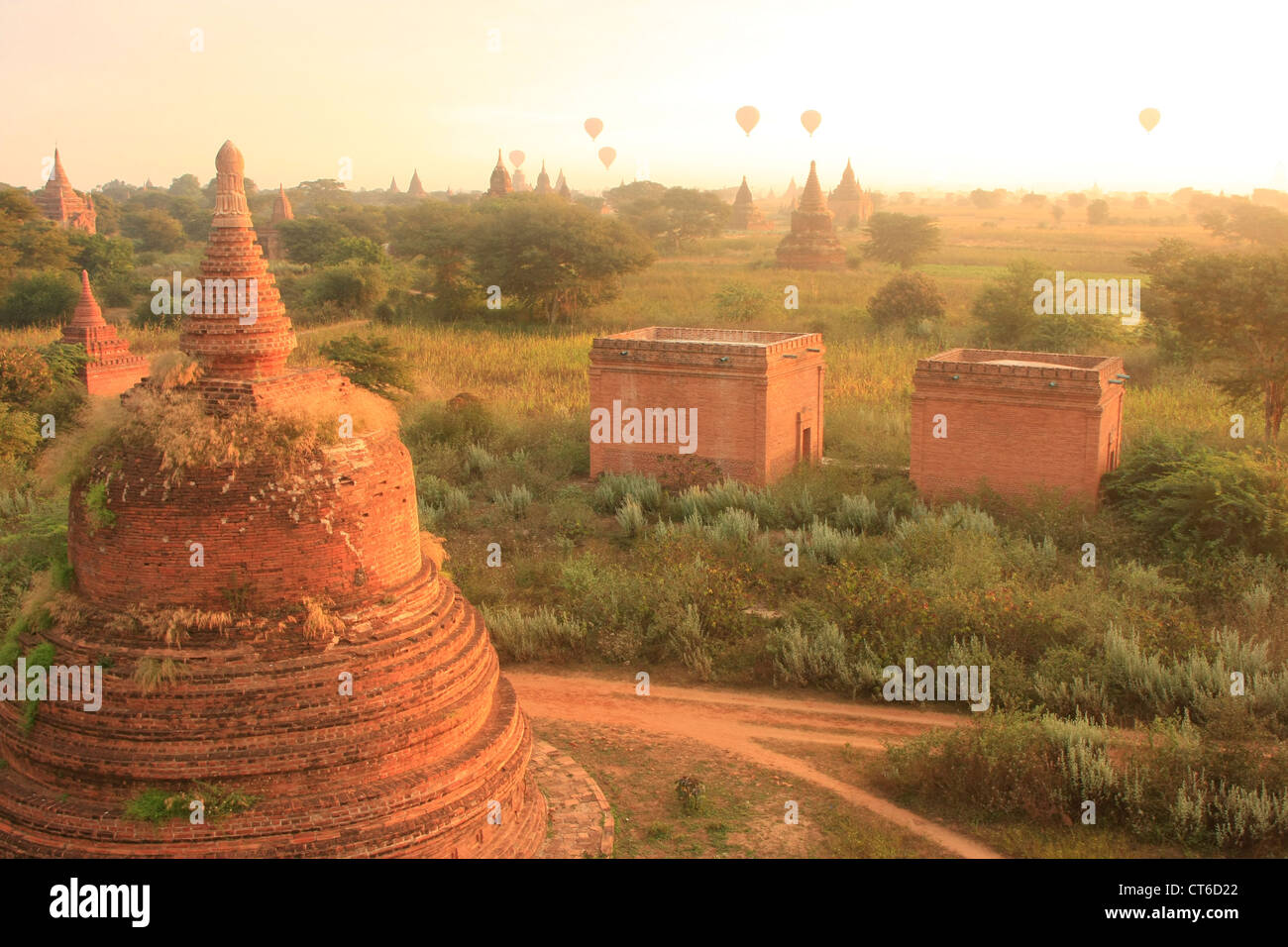 Morning scene with hot-air balloons over temples of Bagan, Bagan ...