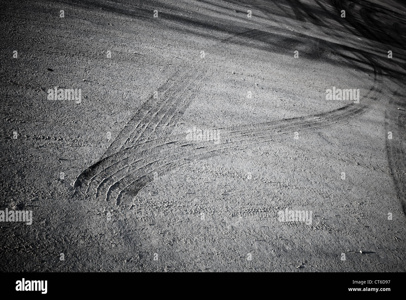 Abstract asphalt road background with crossing of tires tracks Stock ...