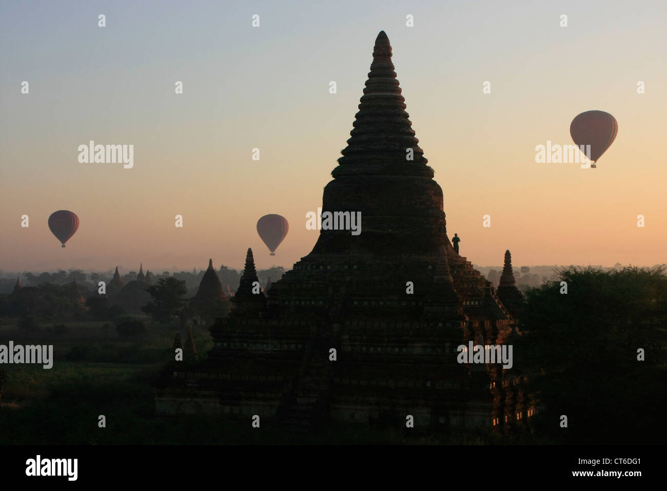 Morning scene with hot-air balloons over temples of Bagan, Bagan ...