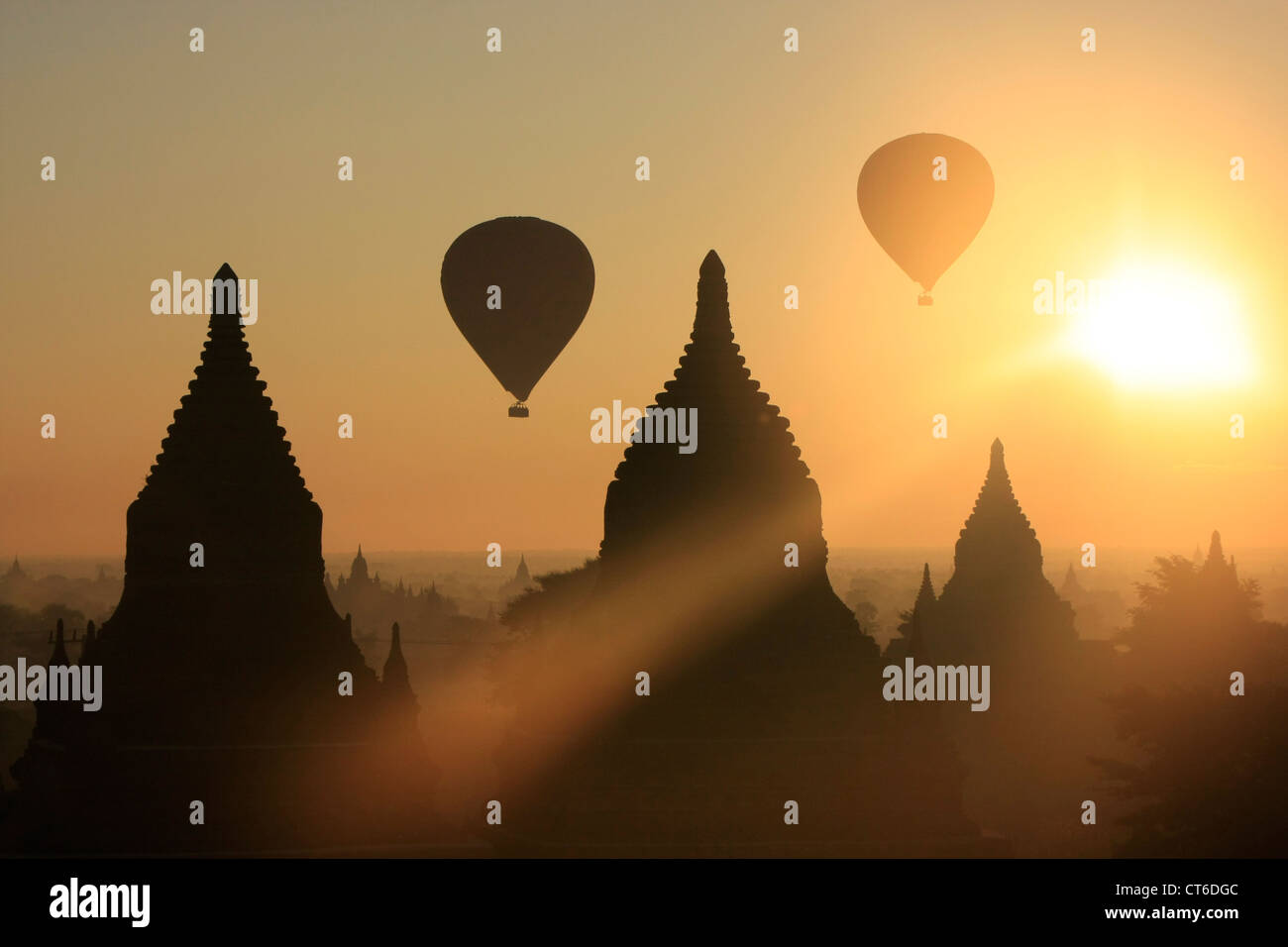 Morning scene with hot-air balloons over temples of Bagan, Bagan ...