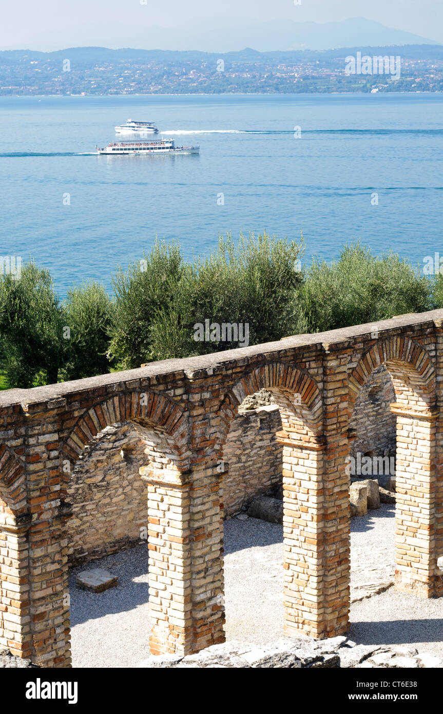 View of Garda Lake and Roman ruins known as "Catullo Caves" in Sirmione ...