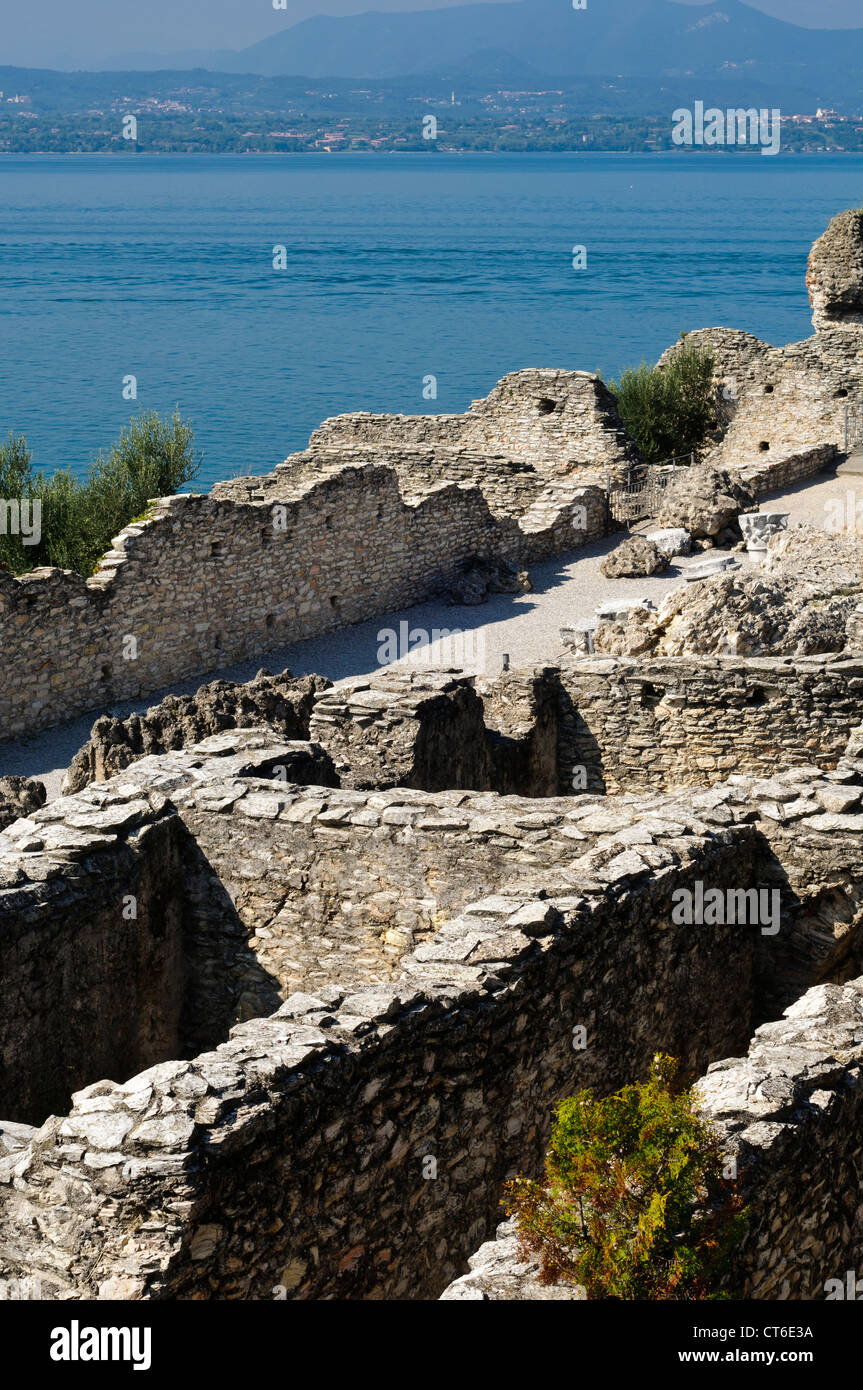 View of Garda Lake and Roman ruins known as "Catullo Caves" in Sirmione ...