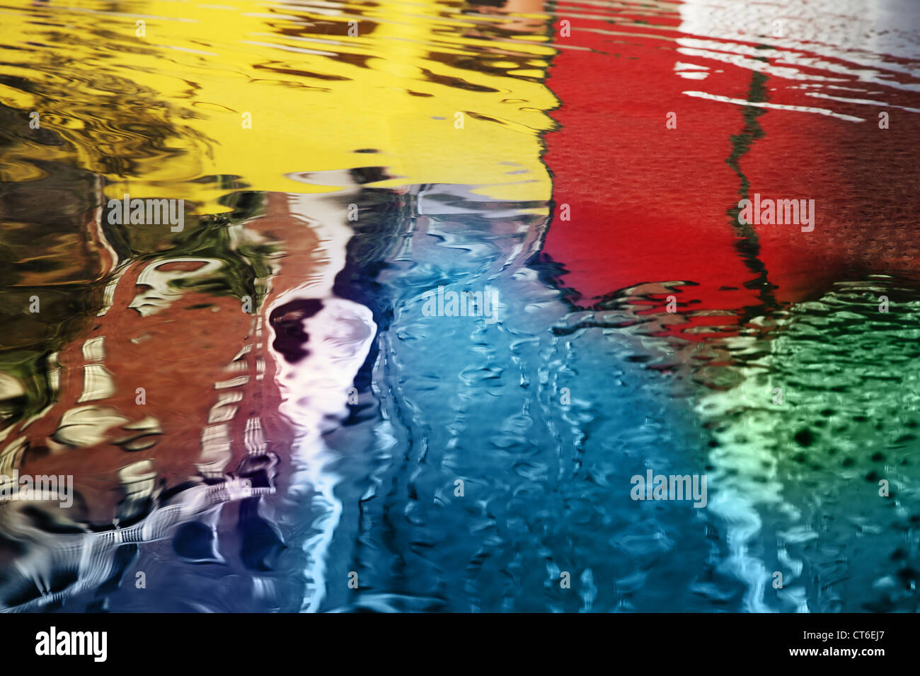 Colorful reflections in rippled water background Stock Photo - Alamy