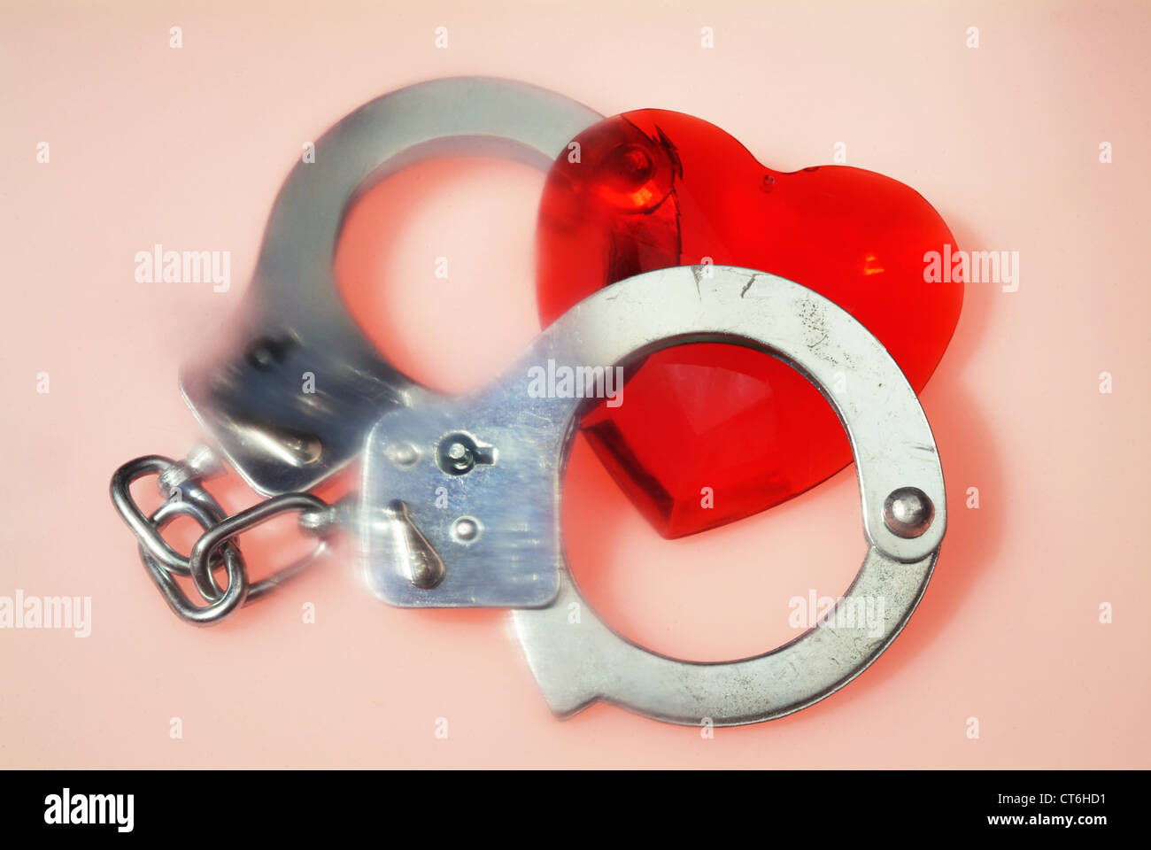 Symbol photo heart with handcuffs Stock Photo - Alamy