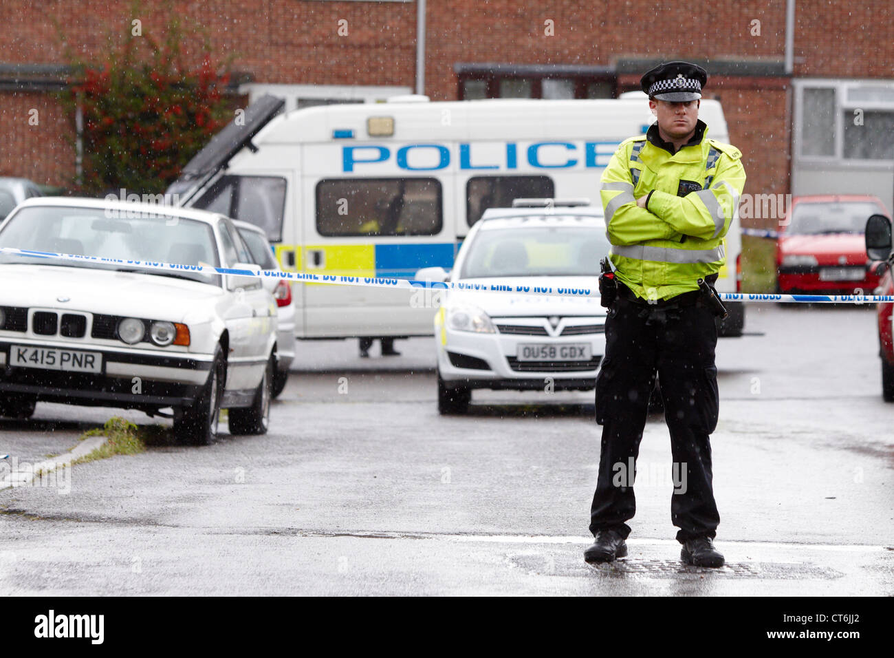 A police officer guards the scene in Ireton Court, Thame, where two ...