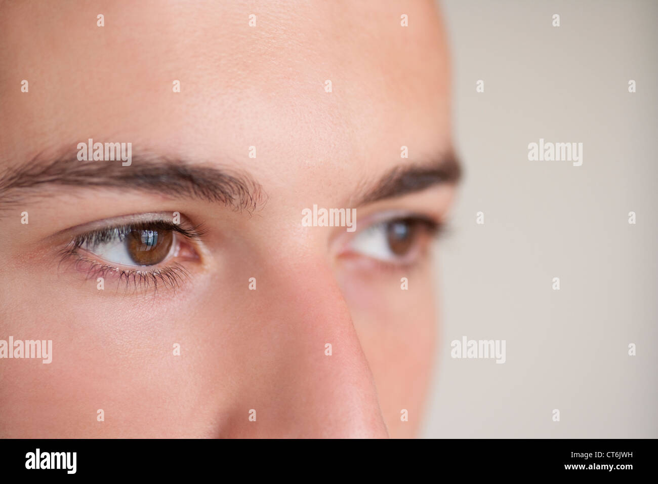 Close up of a serious young man's eyes Stock Photo - Alamy