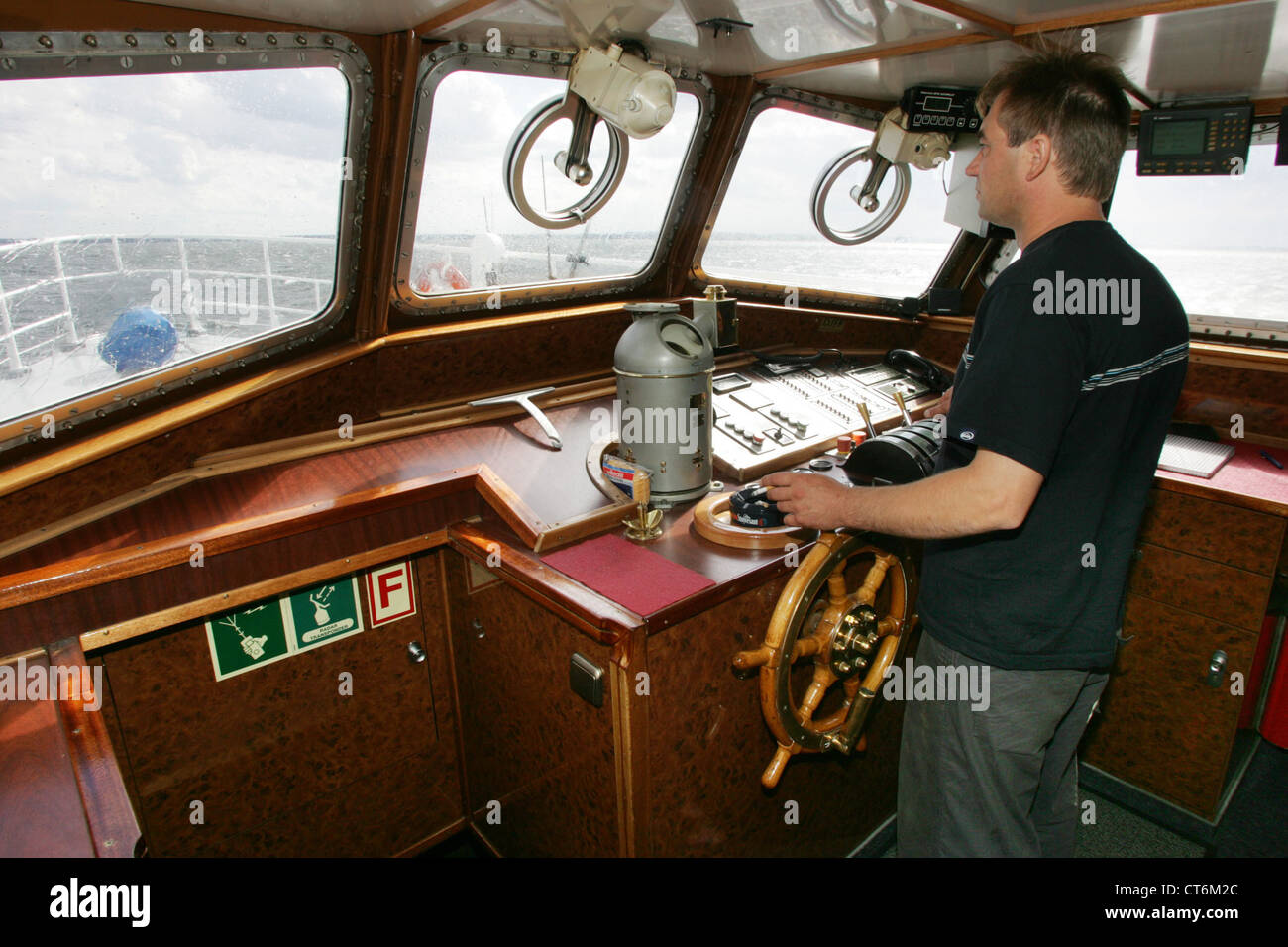 Wismar, captain on a cutter at the exit to the Baltic Sea Stock Photo ...