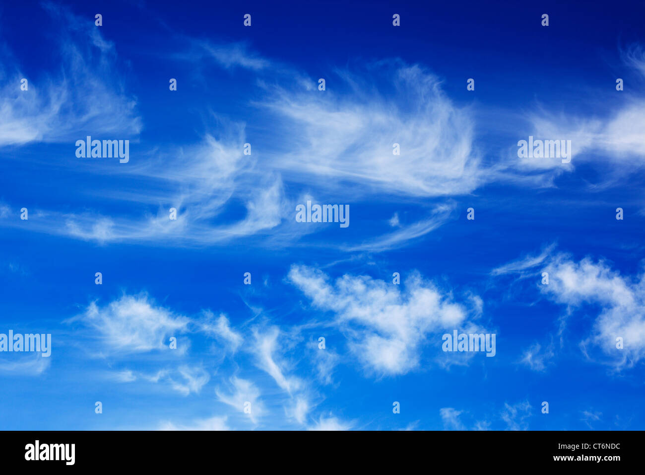Some wispy white clouds blowing across the frame Stock Photo - Alamy
