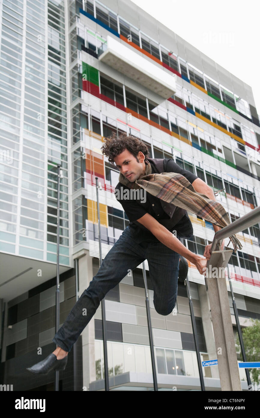 Man jumping over fence in city hi-res stock photography and images - Alamy