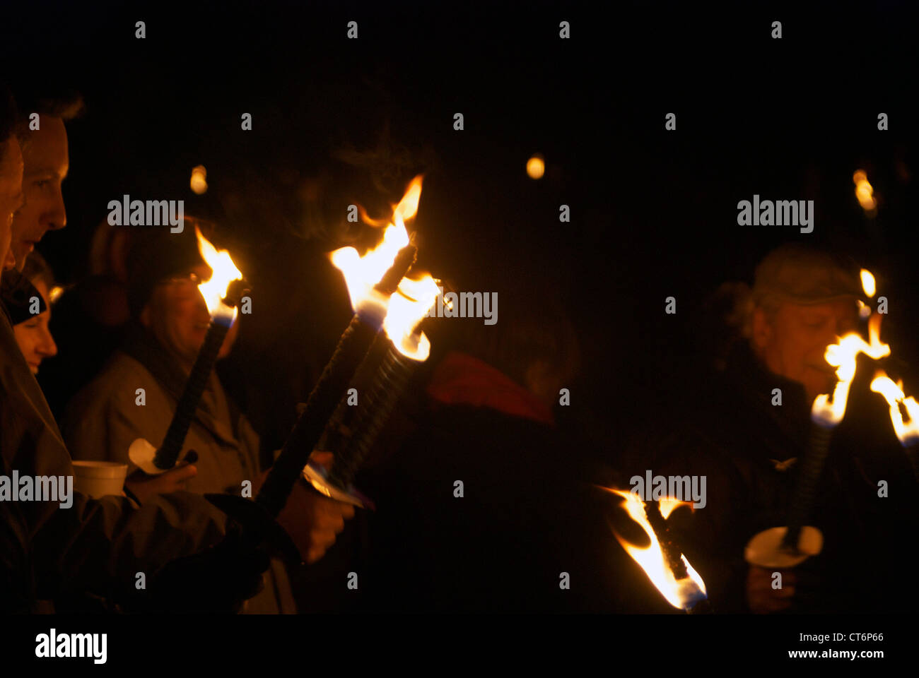 People holding lit flames Stock Photo - Alamy