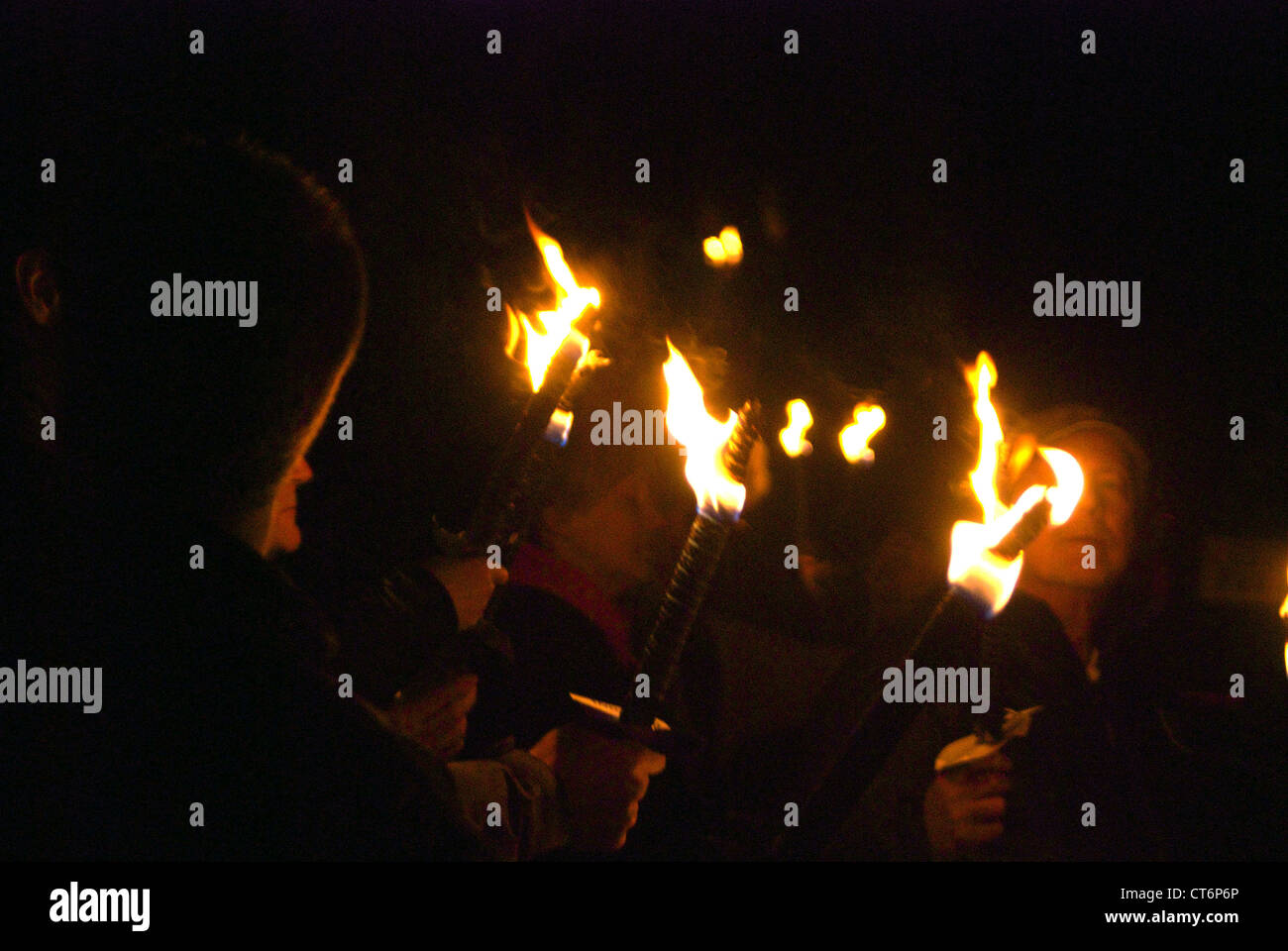 People holding lit flames Stock Photo - Alamy