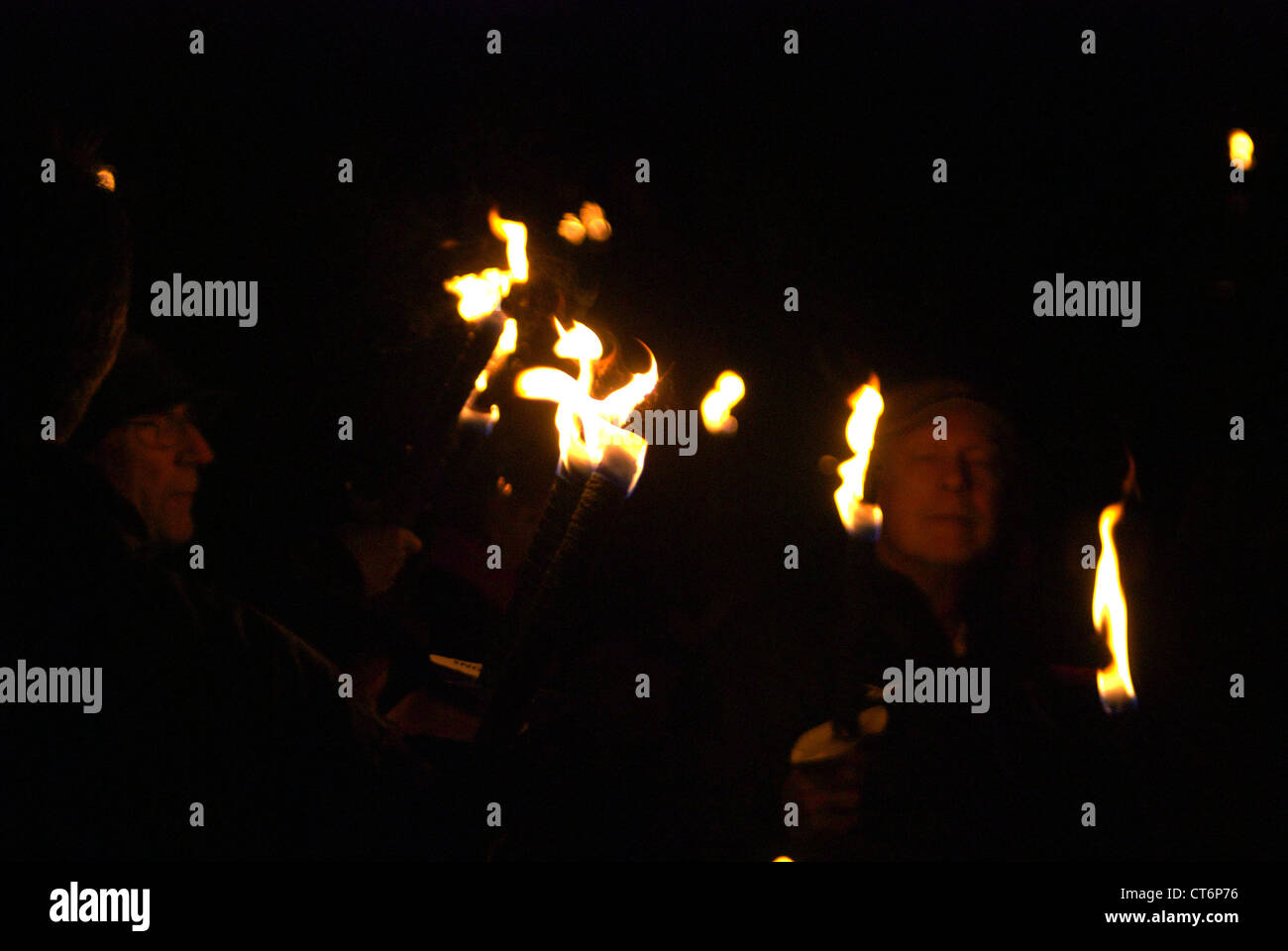 People holding lit flames Stock Photo - Alamy