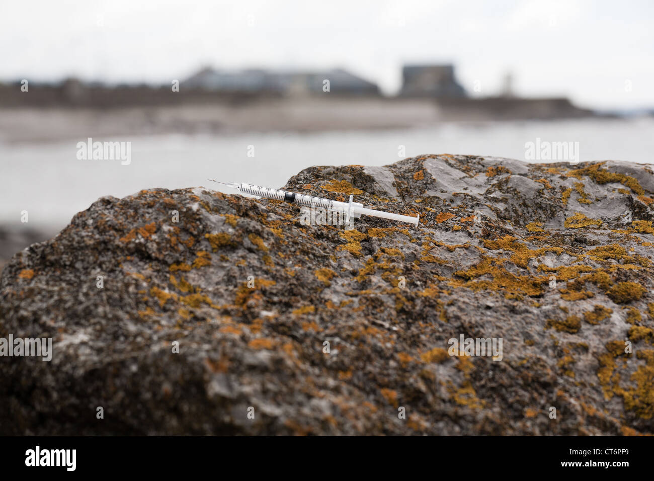Discarded Hypodermic Syringe on a beach Stock Photo - Alamy