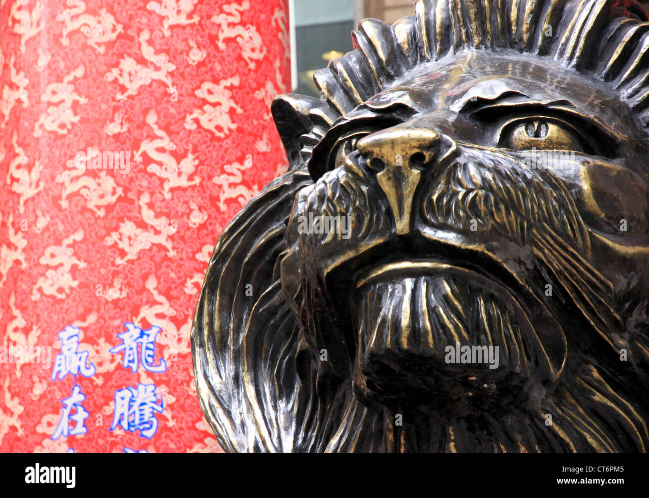 A lion statue at the entrance of a bank building in Chongqing, China ...