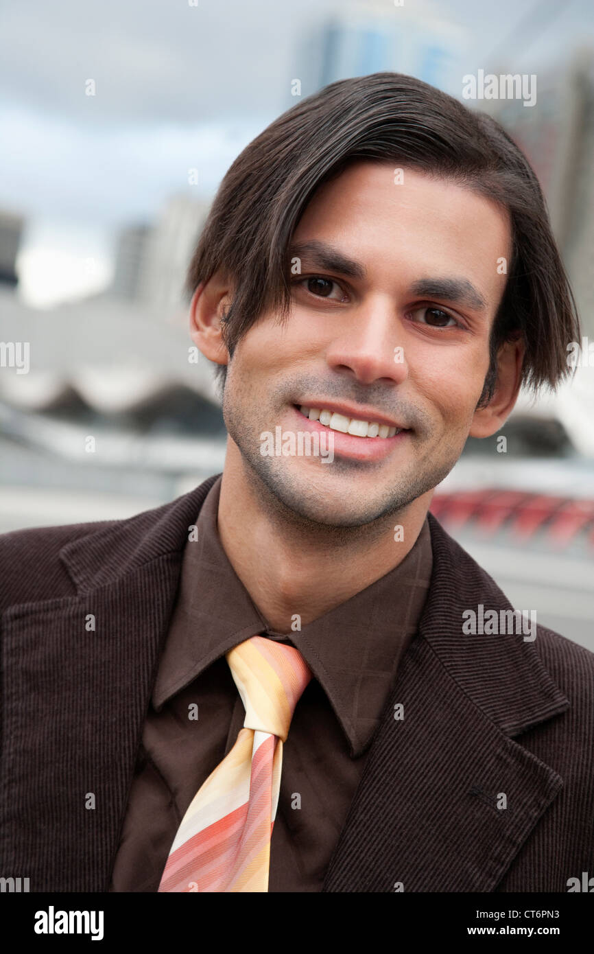 Portrait of a confident businessman smiling Stock Photo - Alamy