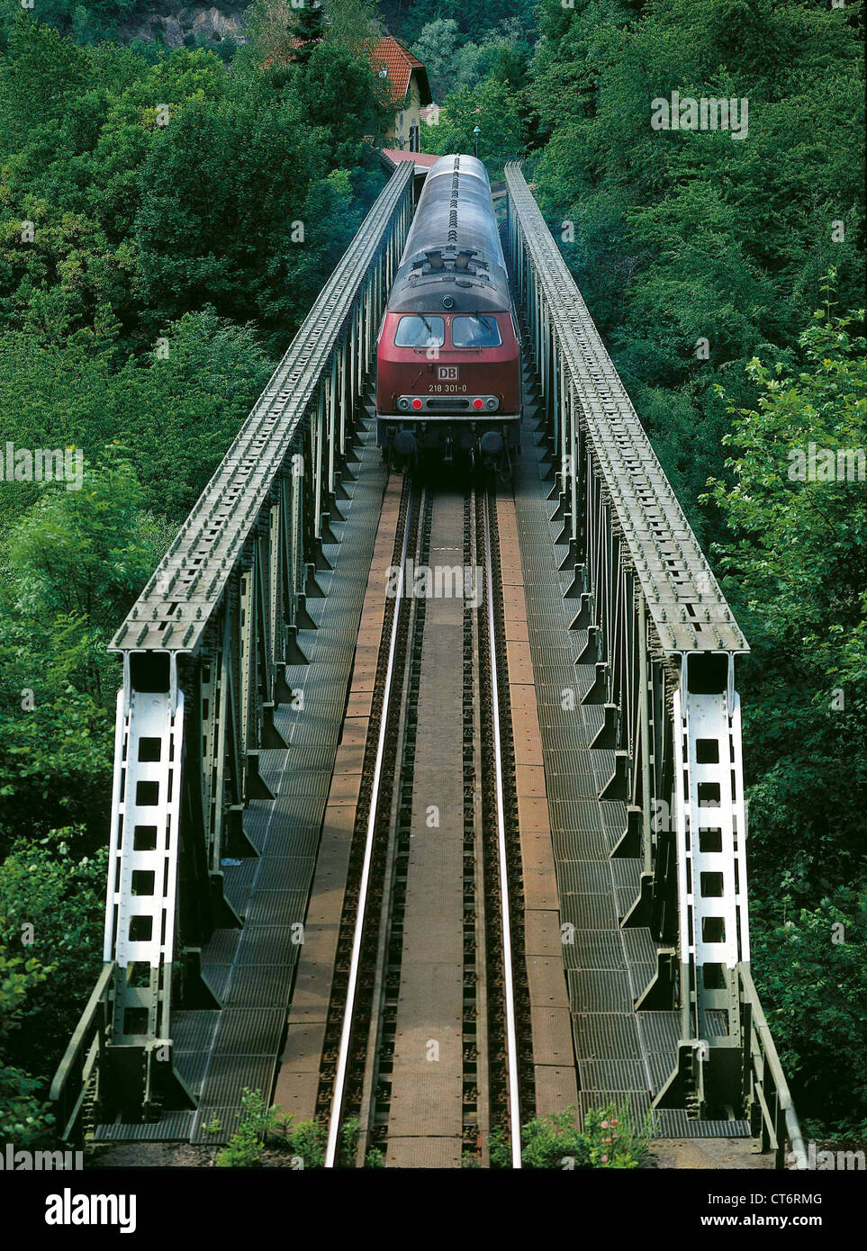 Commuter train on a bridge Stock Photo - Alamy