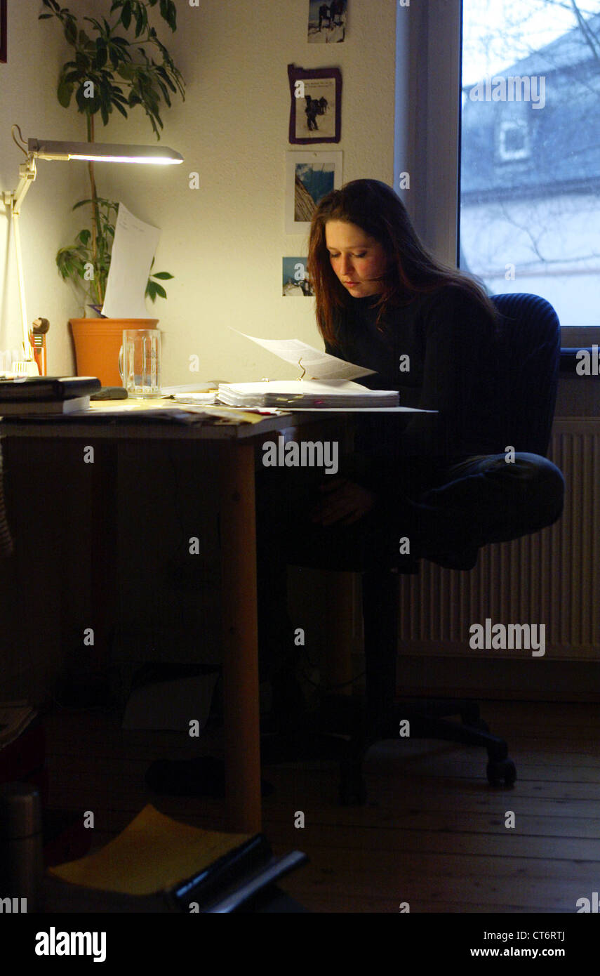 Student sitting at desk and learning Stock Photo - Alamy