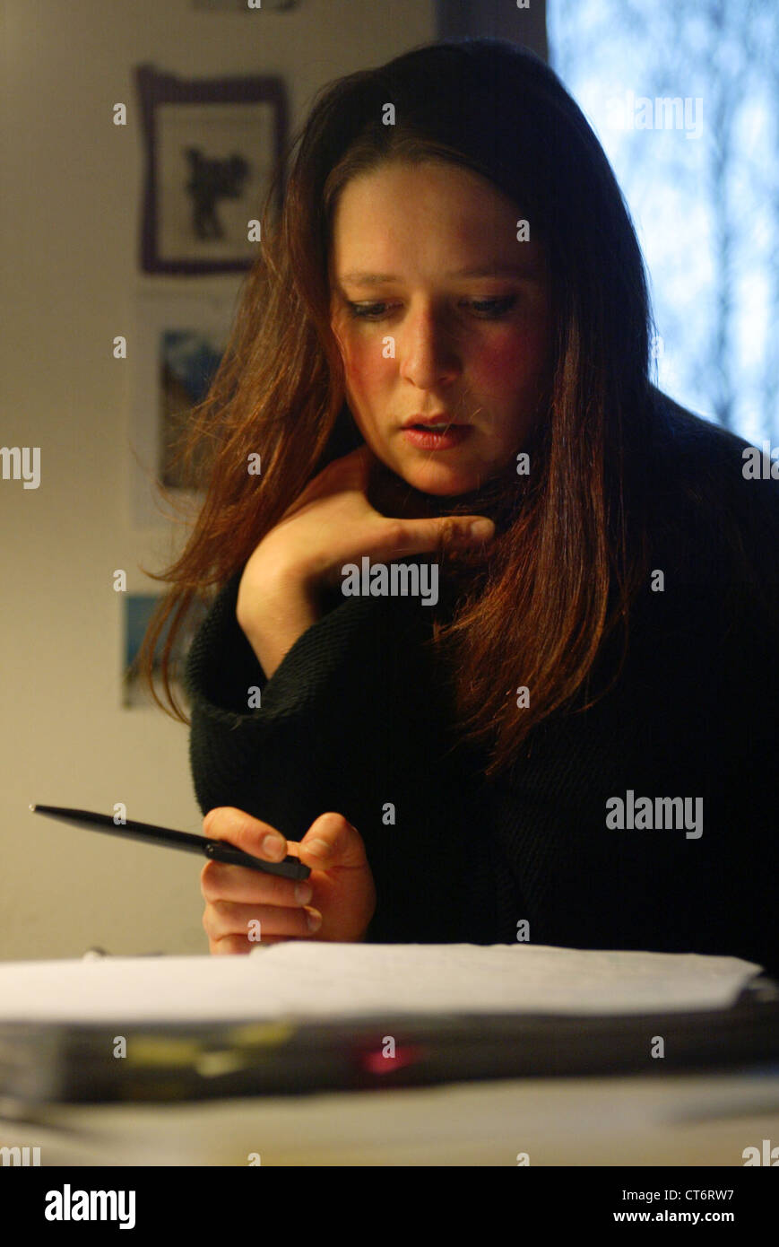 Student sitting at desk and learning Stock Photo - Alamy