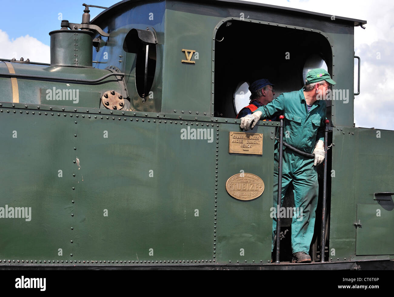 Engine driver driving steam train at the depot of the Chemin de Fer à ...
