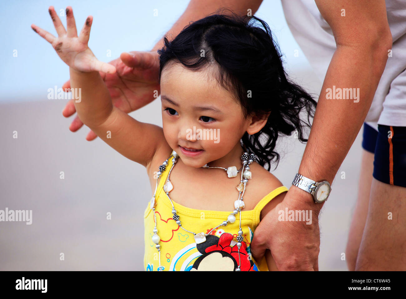 Portrait of the beautiful small Asian girl with father. Indonesia. Java ...