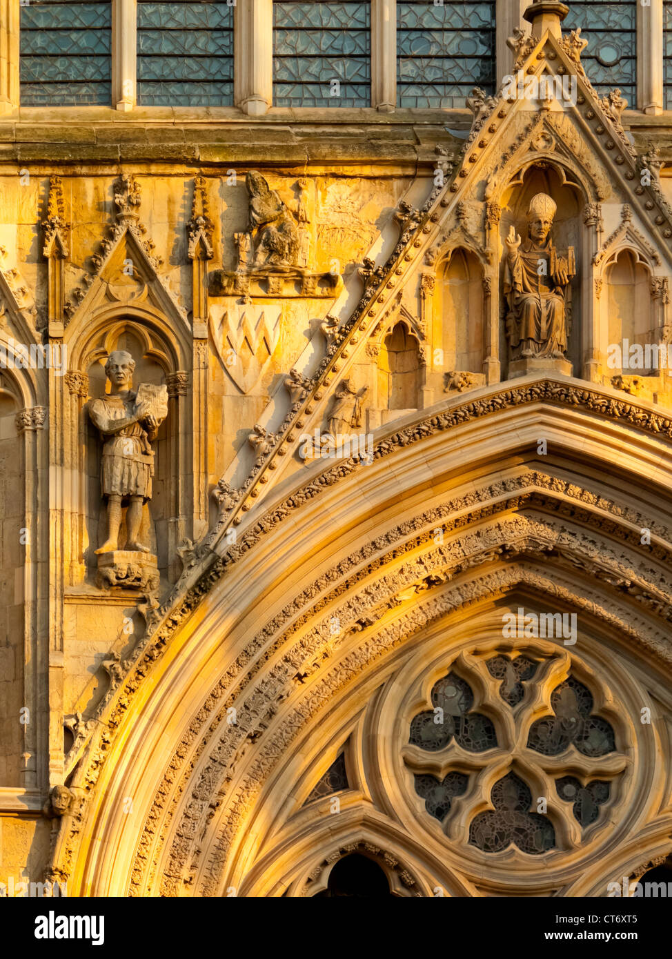 Detail of carved gothic stonework and windows on the West Front of York ...