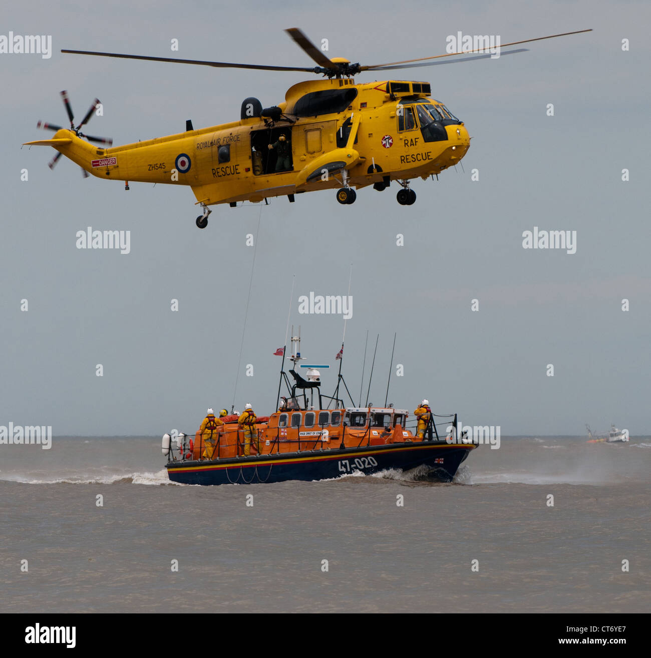 RAF SAR Sea King performing an off-shore rescue exercise with RNLI Tyne ...