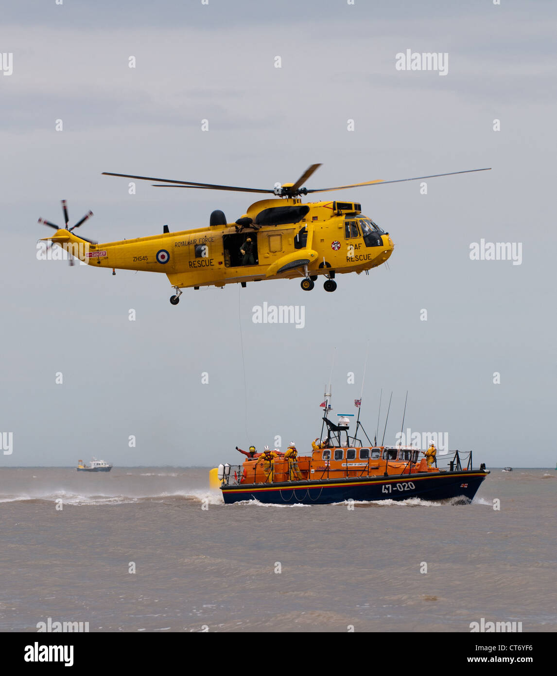 RAF SAR Sea King performing an off-shore rescue exercise with RNLI Tyne ...