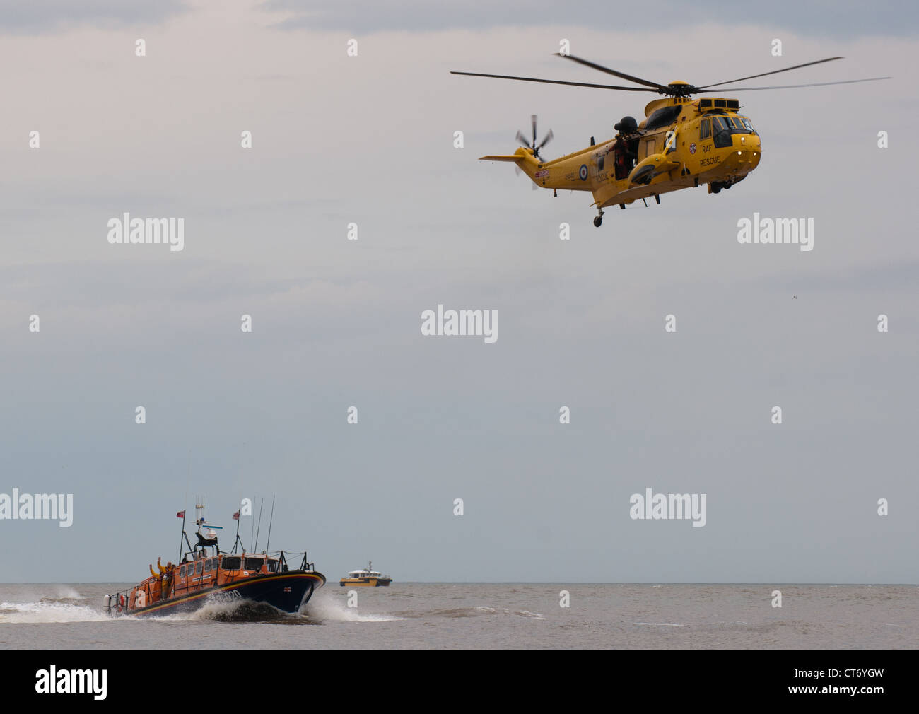 RAF SAR Sea King performing an off-shore rescue exercise with RNLI Tyne ...