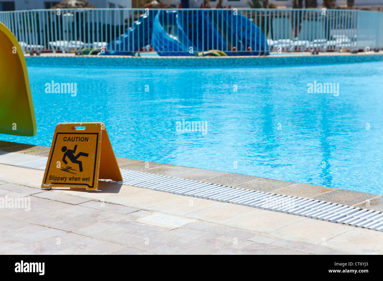 Sign Slippery Floor by the poolside Stock Photo - Alamy