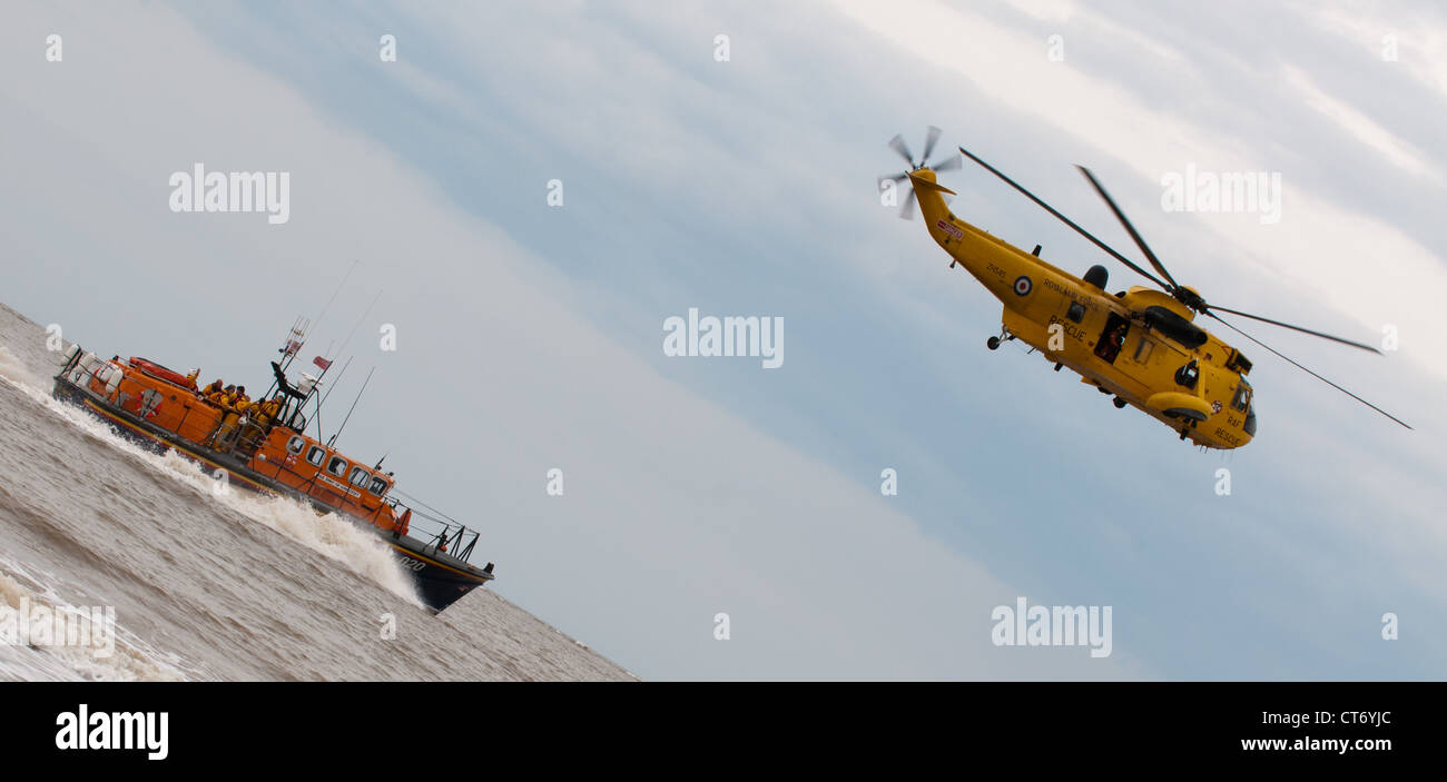 RAF SAR Sea King performing an off-shore rescue exercise with RNLI Tyne ...