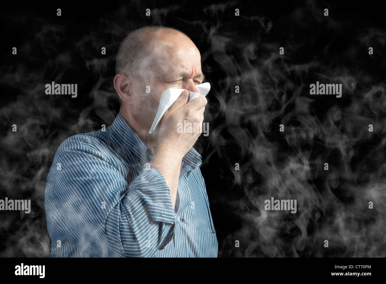 man covers his mouth for smoking Stock Photo - Alamy