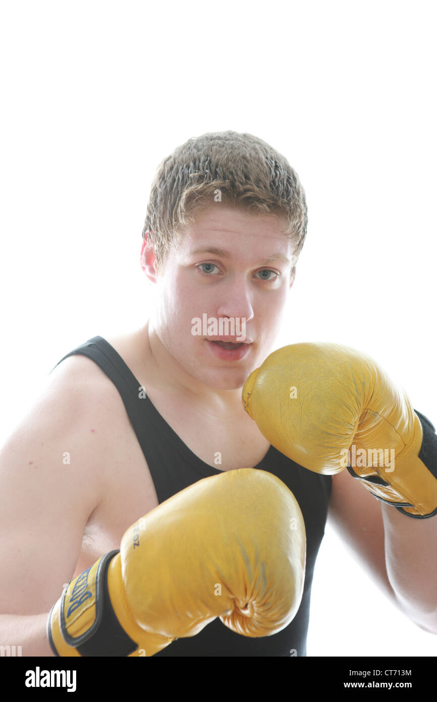 Young man in boxing pose Stock Photo - Alamy