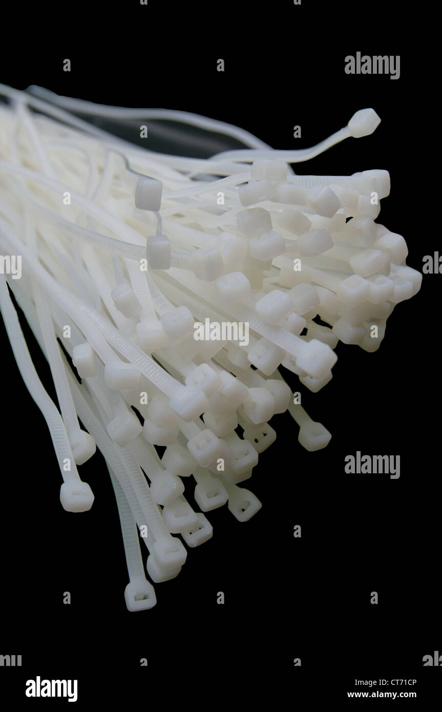 Plastic clamp to connect the wires in a bundle Stock Photo - Alamy