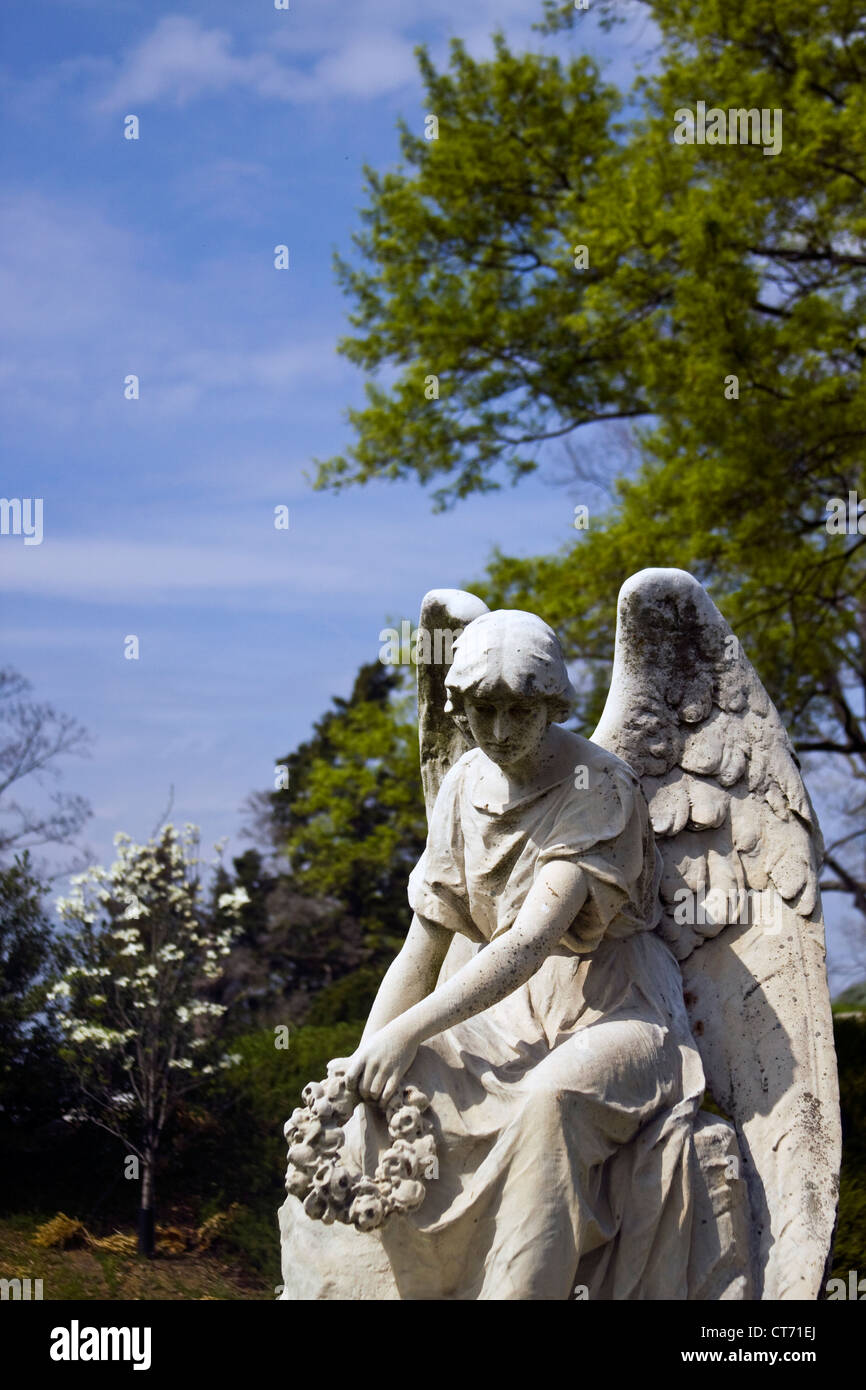 A female angle statue with flowered wreath at historic Hollywood ...