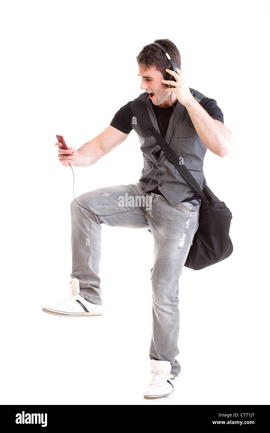 Full length portrait school boy with phone isolated on white. Music or ...