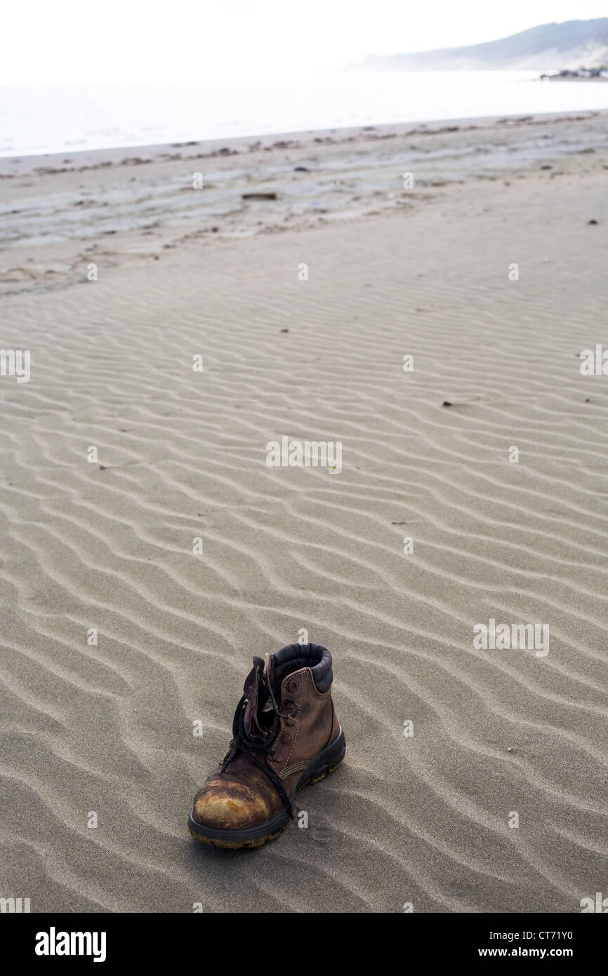 old boot on beach sand Stock Photo - Alamy